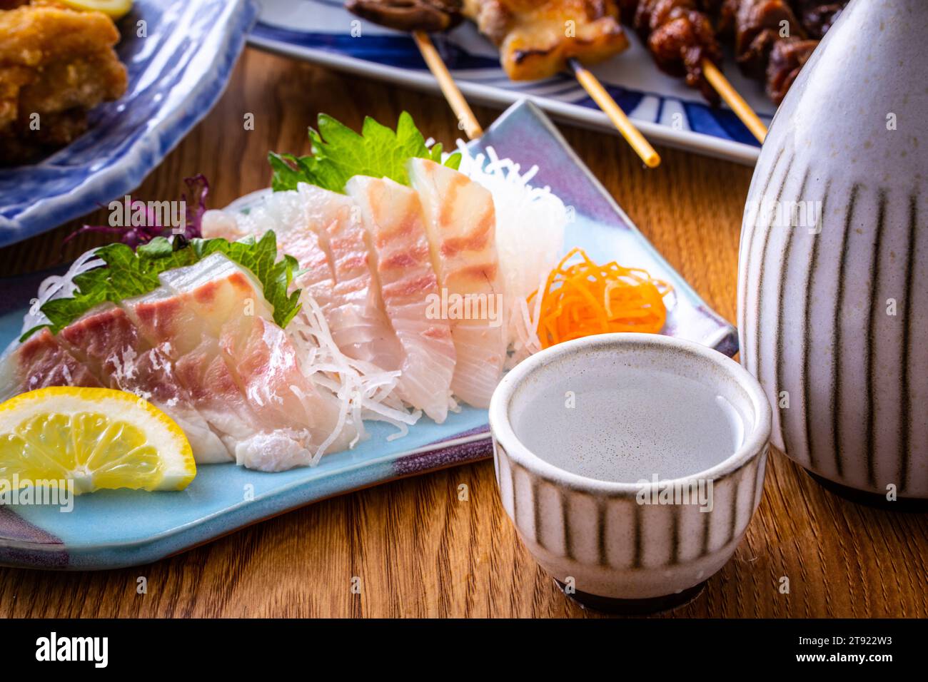 Japanese sake and food at a Japanese izakaya Stock Photo - Alamy