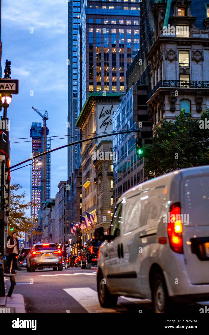 Traffic in Manhattan, New York City at dusk with cars driving through ...