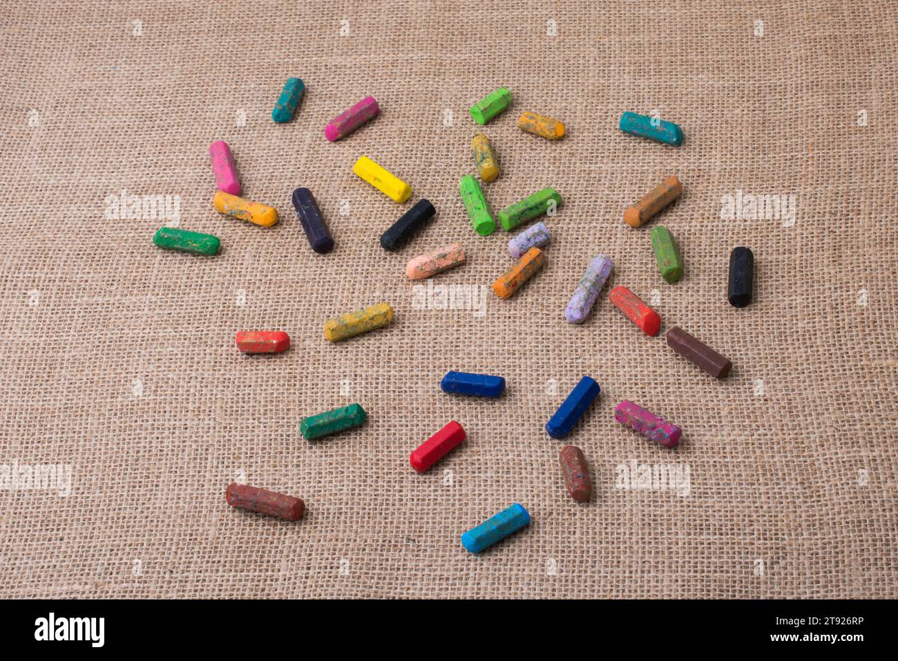 Used crayons of various color on a canvas Stock Photo - Alamy
