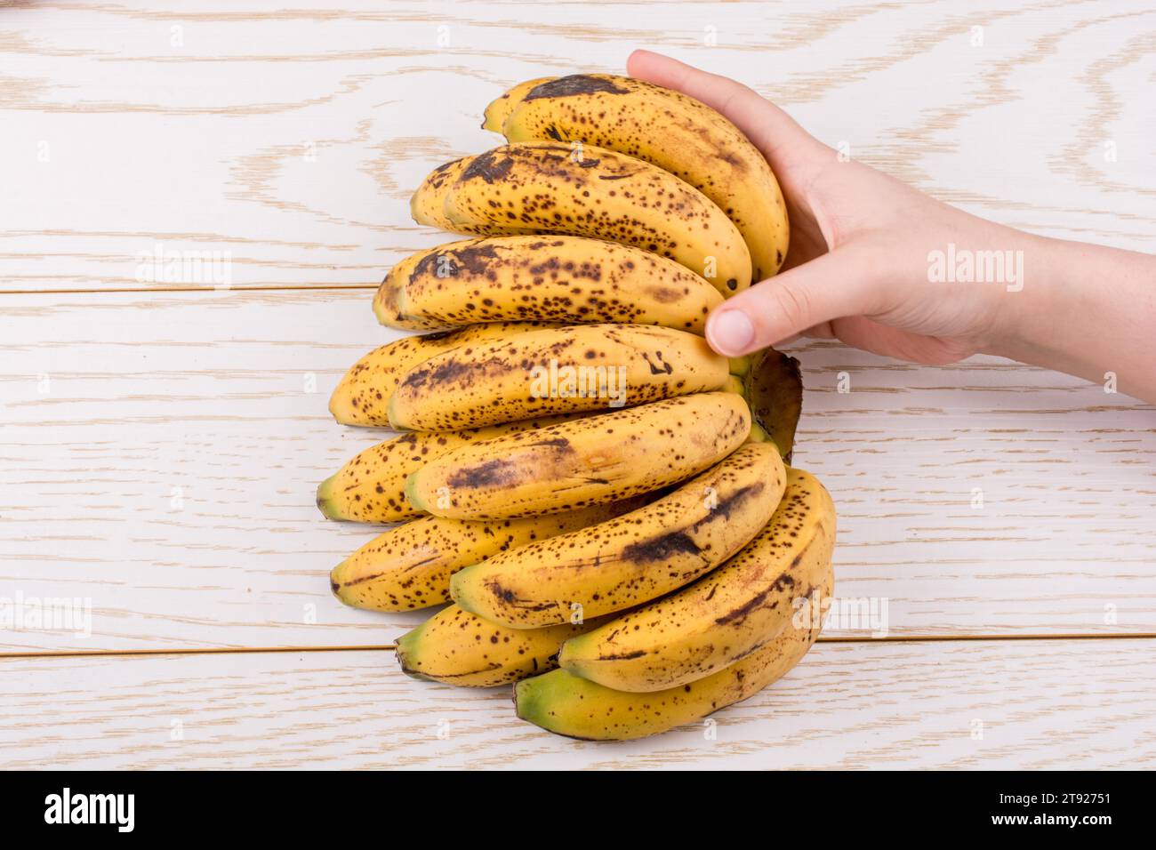 Holding bunch bananas hi-res stock photography and images - Alamy