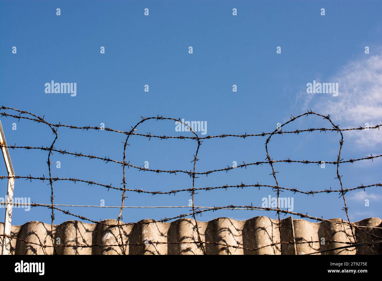 Barbed wire fence used for protection purposes Stock Photo - Alamy