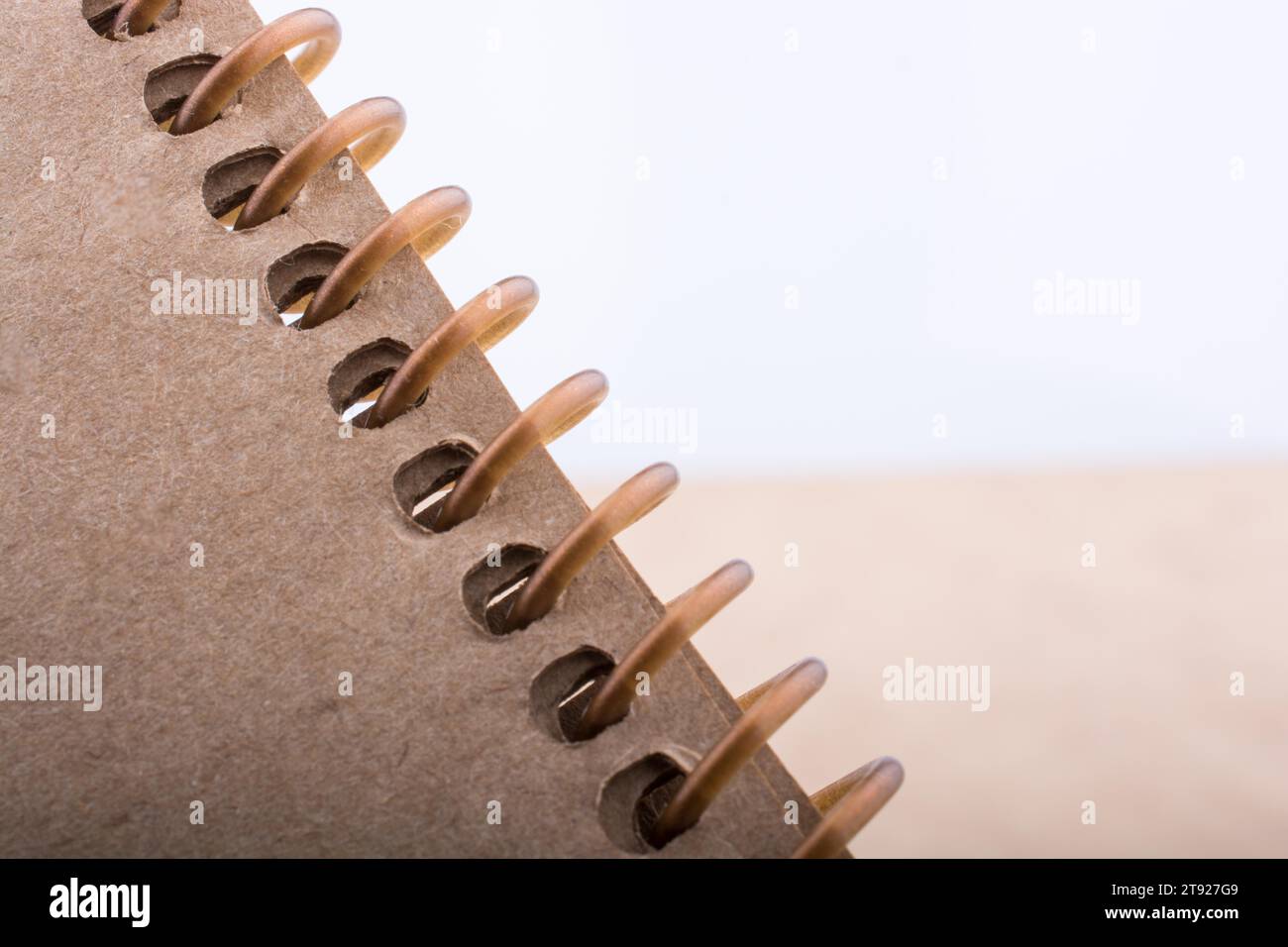 Part of a brown color notebook on a white background Stock Photo - Alamy