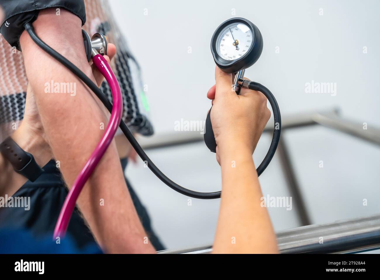 Hand of a cardiologist with a tool to measure the blood pressure Stock ...