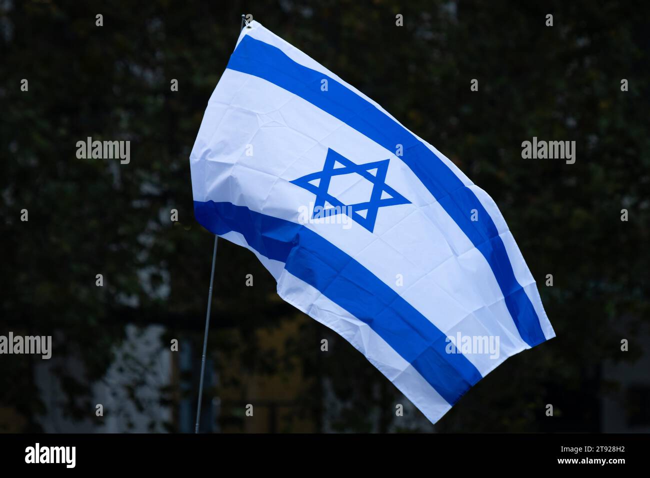An Israel flag blows in the wind. Under the motto Never again is now ...