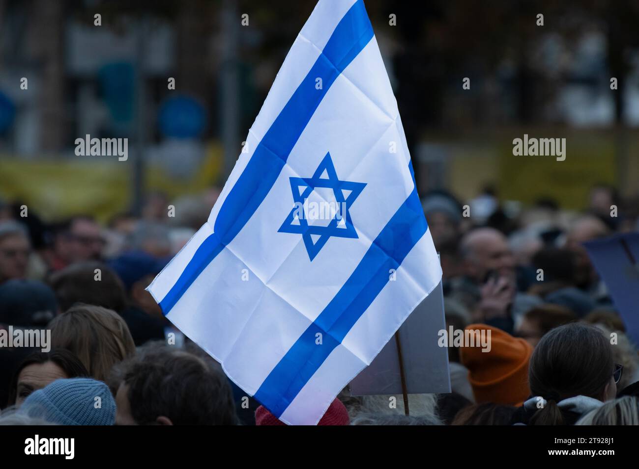 An Israel flag blows in the wind. Under the motto Never again is now ...