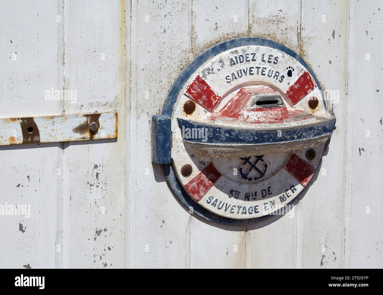 Donation box on the door to the historic lighthouse Phare du Cap Frehel ...