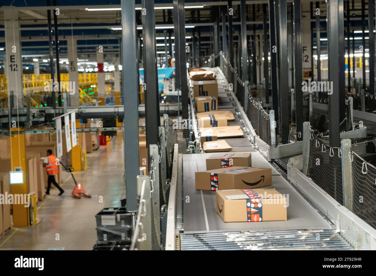 Parcels move on conveyor belts at Amazon's fulfillment centre in ...