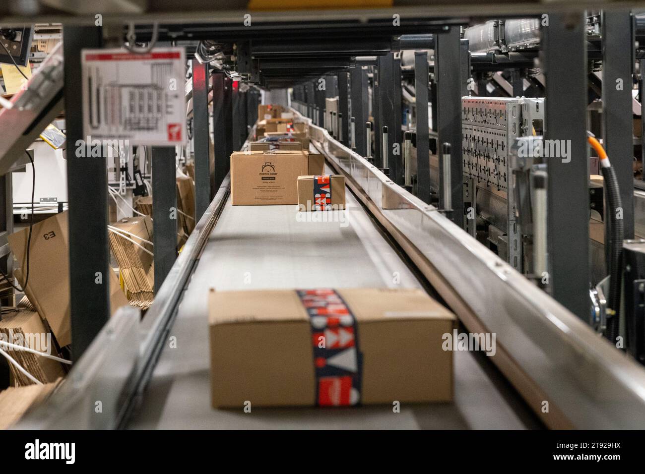 Parcels move on conveyor belts at Amazon's fulfillment centre in ...