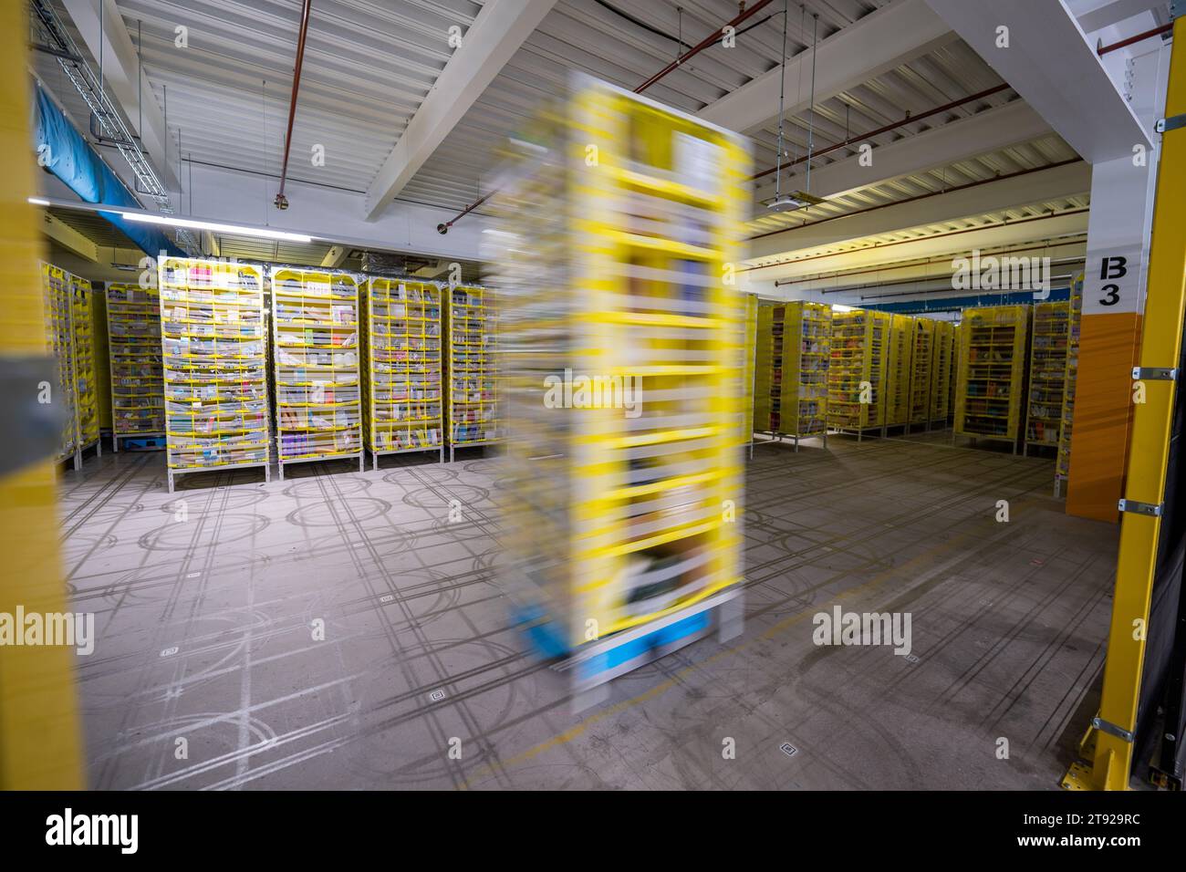 Yellow shelves move around on blue automated robots, called Hercules ...