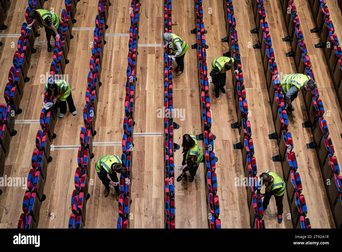 Staff clean a section of 2100 seats, designed by Rana Begum, inside ...