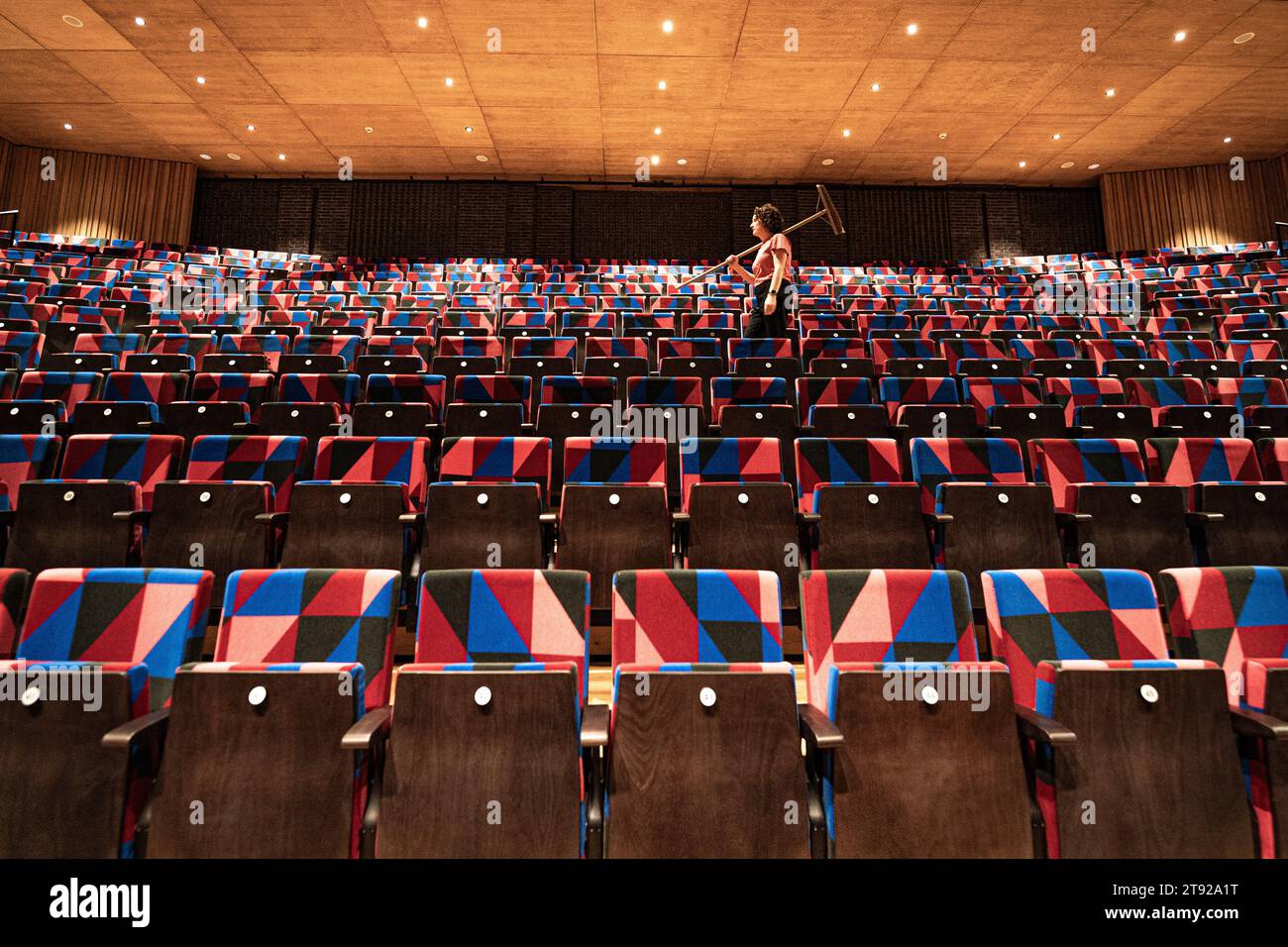 Staff clean a section of 2100 seats, designed by Rana Begum, inside ...