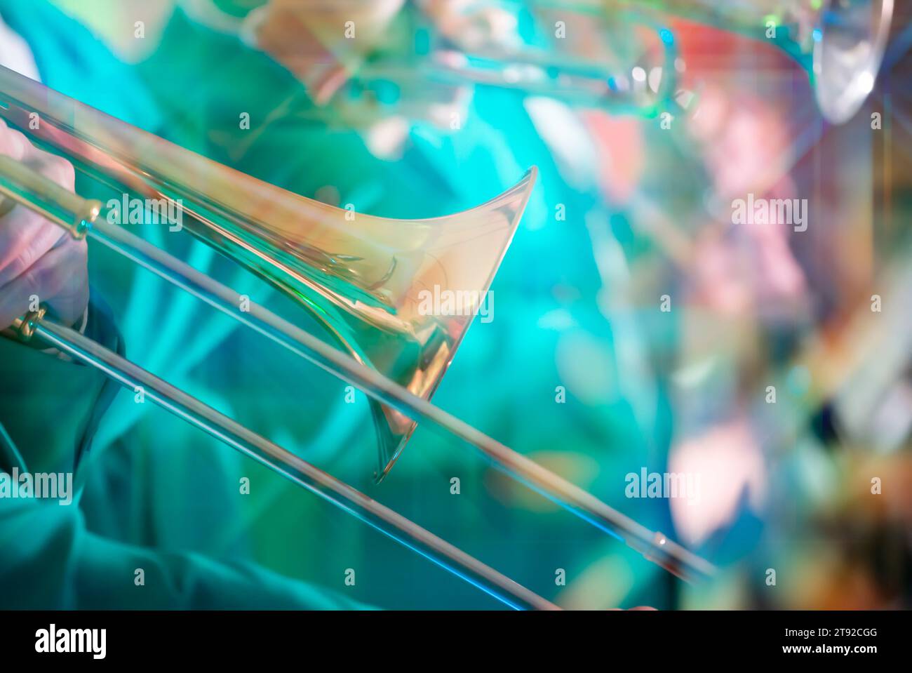 Blurred musical background with golden trumpets on an emerald ...