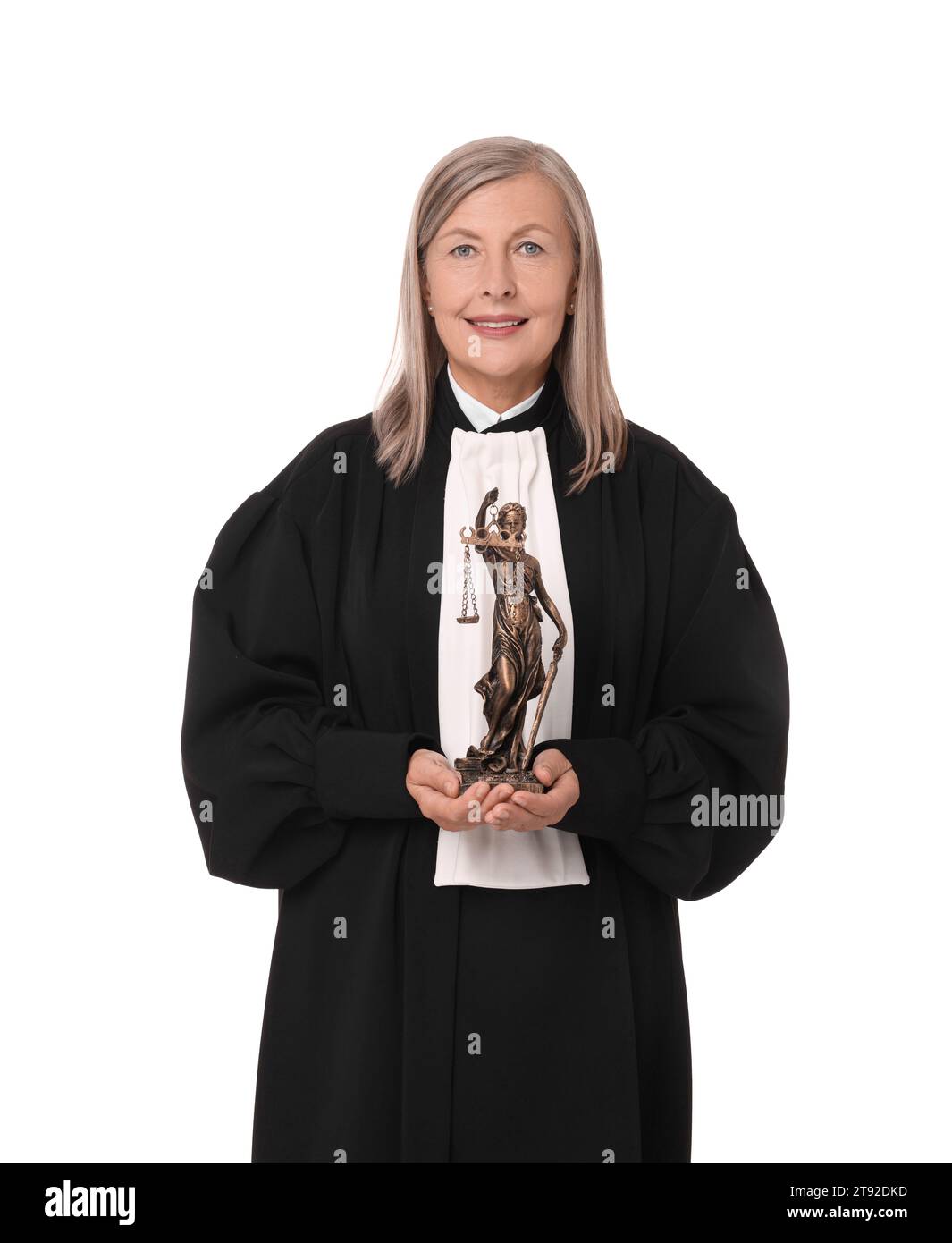 Smiling senior judge with figure of Lady Justice on white background ...
