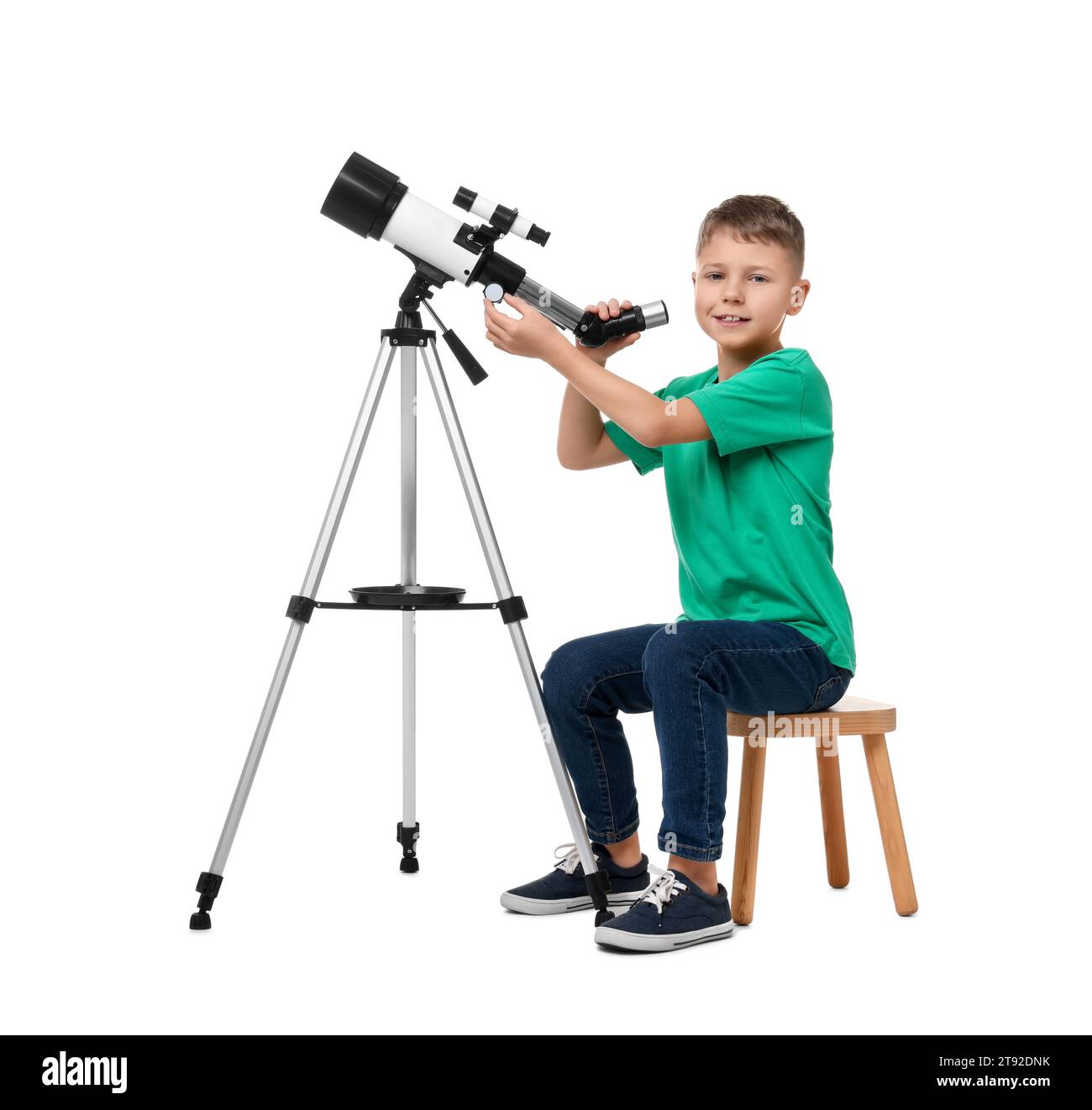 Happy little boy with telescope on white background Stock Photo - Alamy