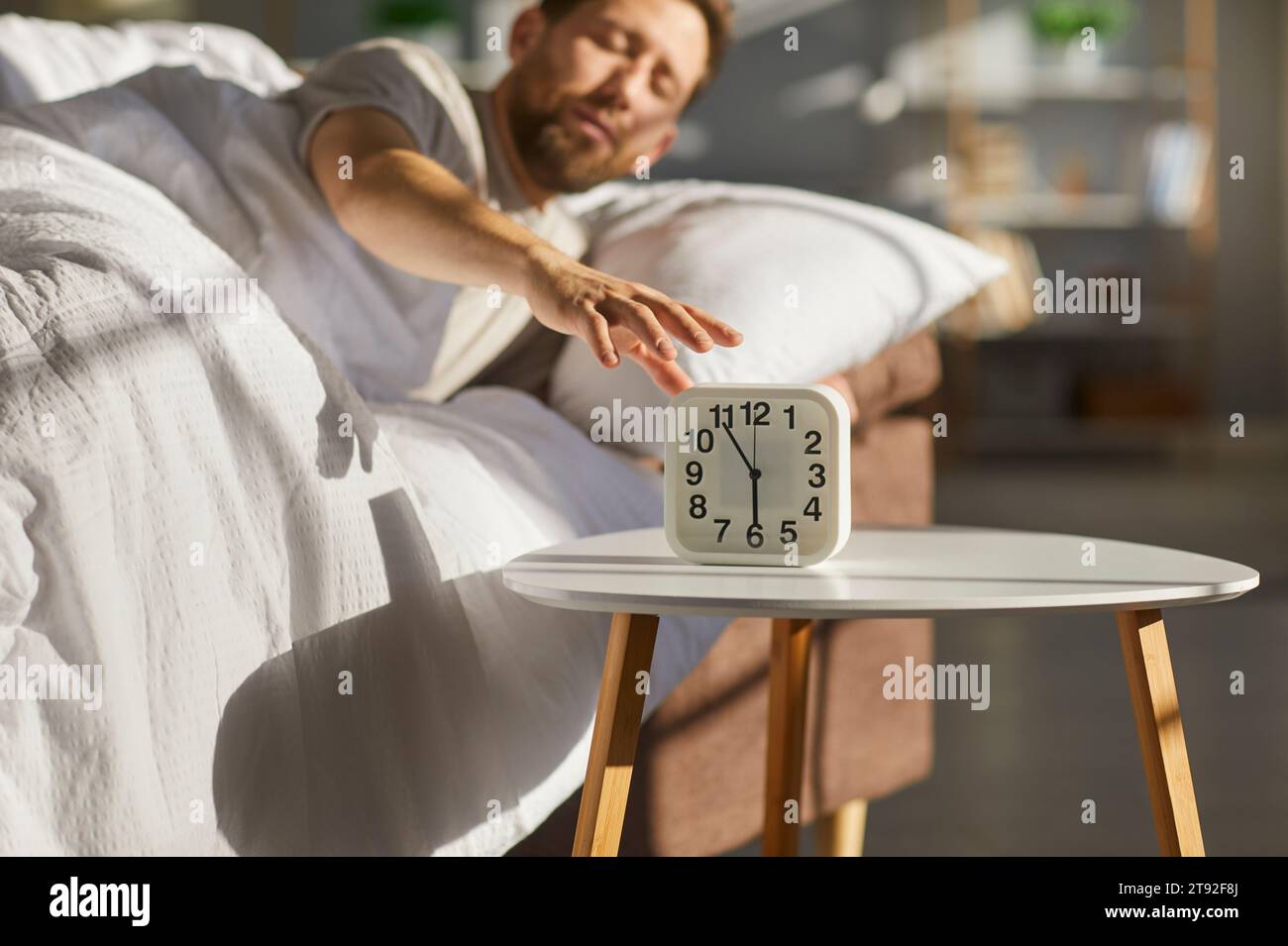 Man alarm clock switch off hi-res stock photography and images - Alamy