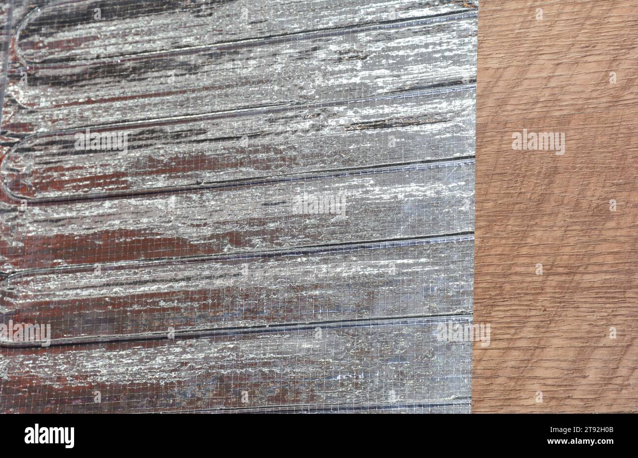 Electric radiant system. Close up on wall heating system with ...