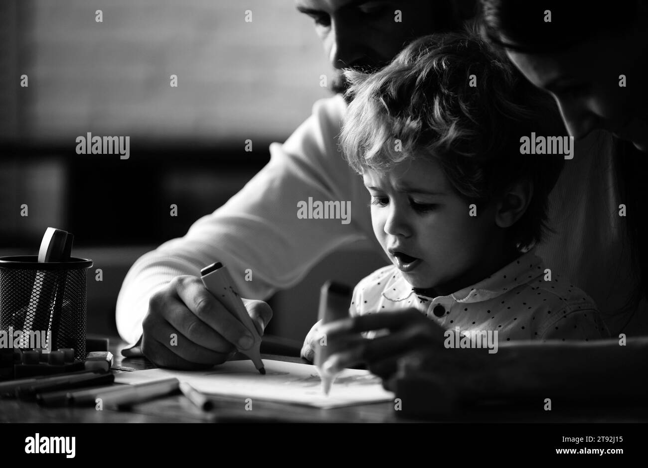 Happy family portrait having fun together. Kids early arts and crafts ...