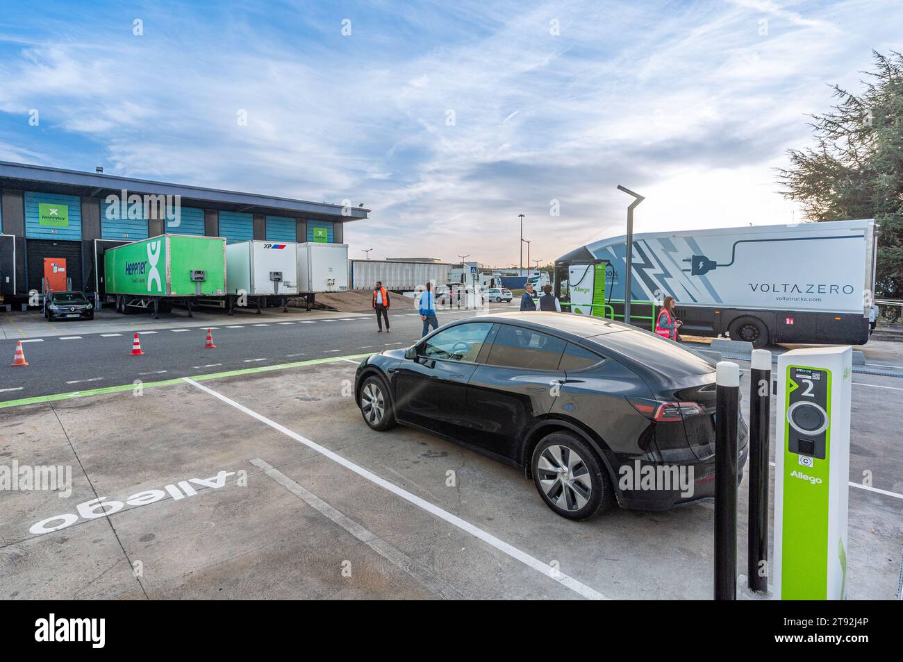 The picture shows an Allego charging hub where a Tesla and some ...