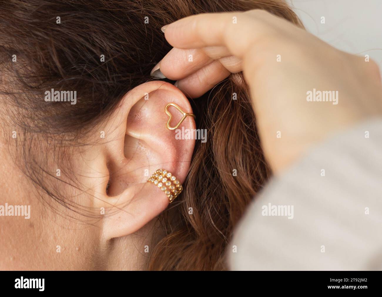 Gold ear cuff hi-res stock photography and images - Alamy
