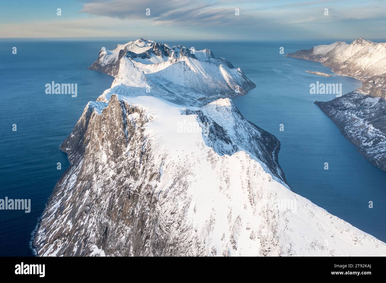 Early morning glow light on snow covered mountains in arctic Norway ...