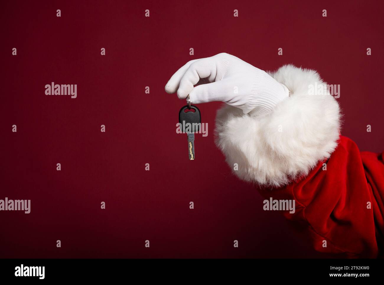 Santa claus hand with key Stock Photo - Alamy