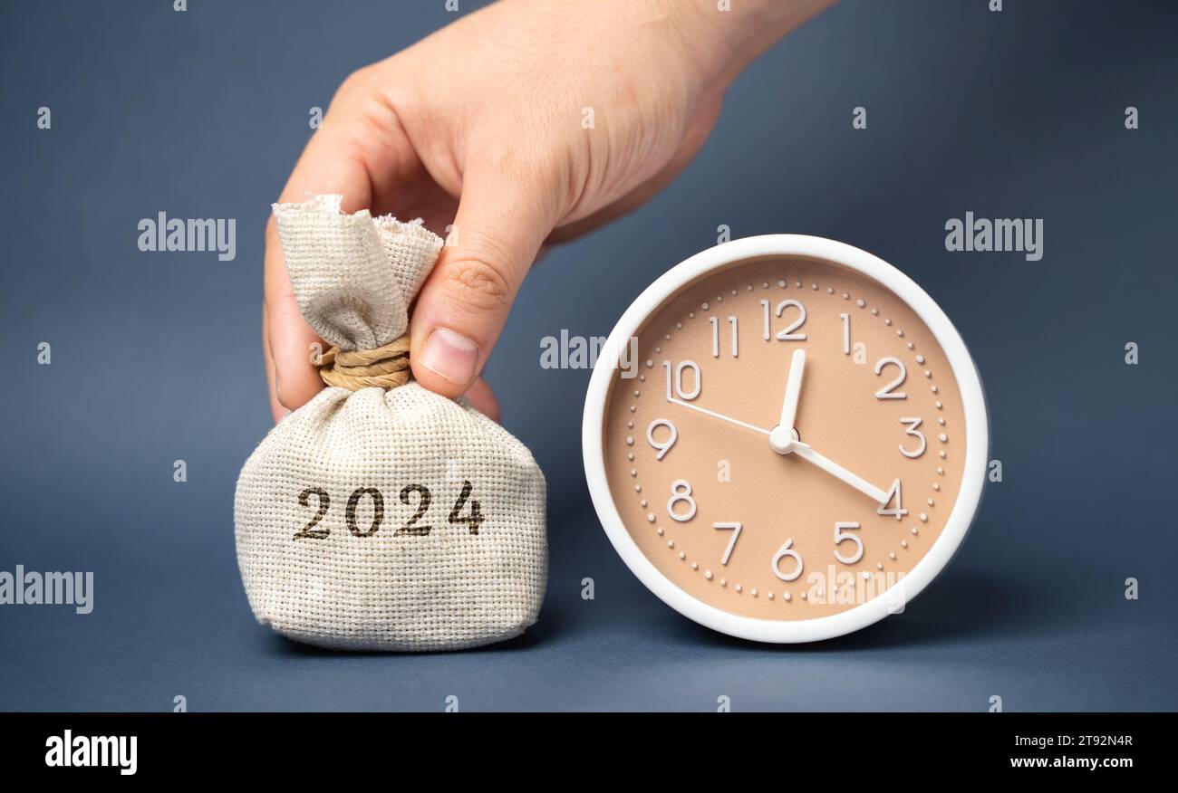 Money bag 2024 and clock. Budget planning. Financial goals and plans ...