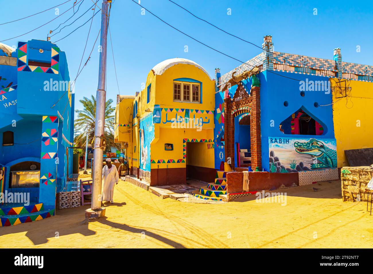Bright colored houses in a famous Nubian village. Aswan, Egypt ...