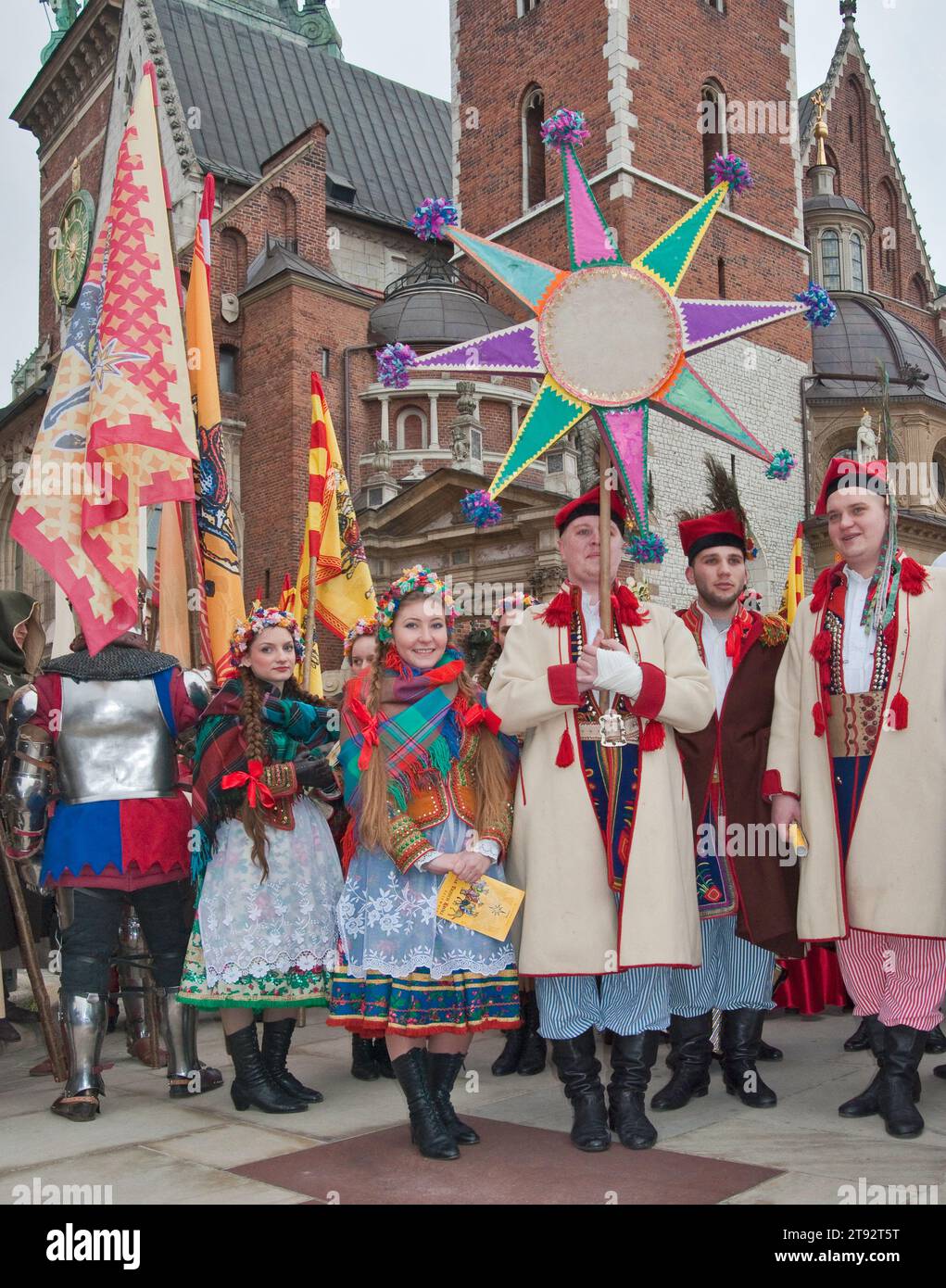 People wearing Krakow region costumes, carrying Star of Bethlehem, in ...