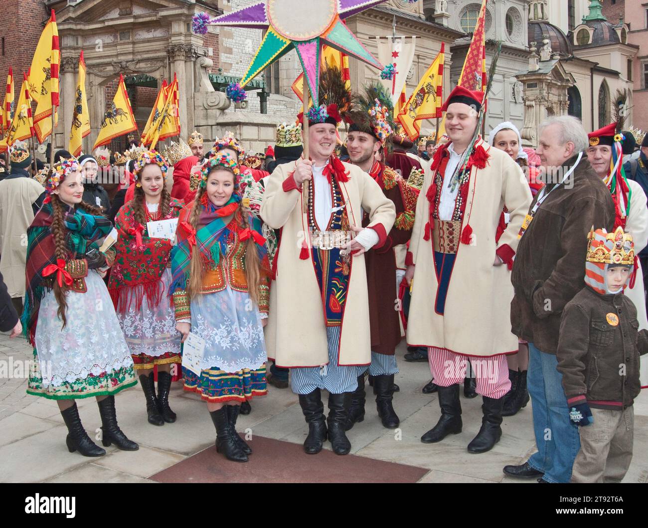 People wearing Krakow region costumes, carrying Star of Bethlehem, in ...