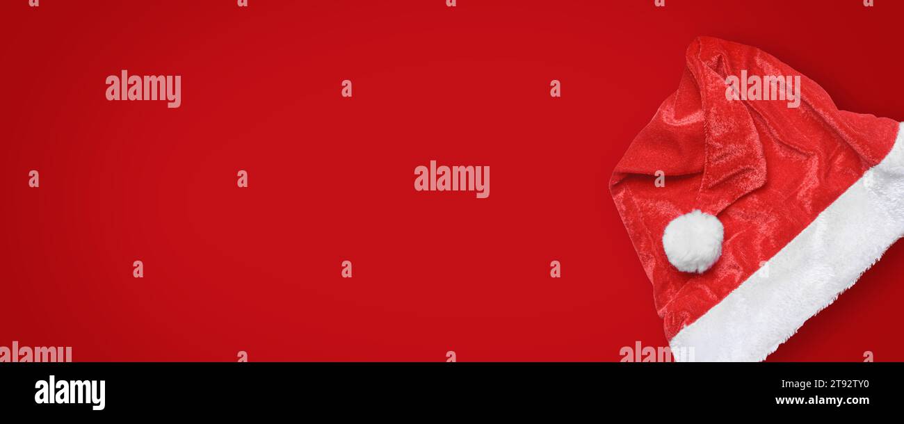 Santa Claus hat on red background. Design element, wide banner, header ...