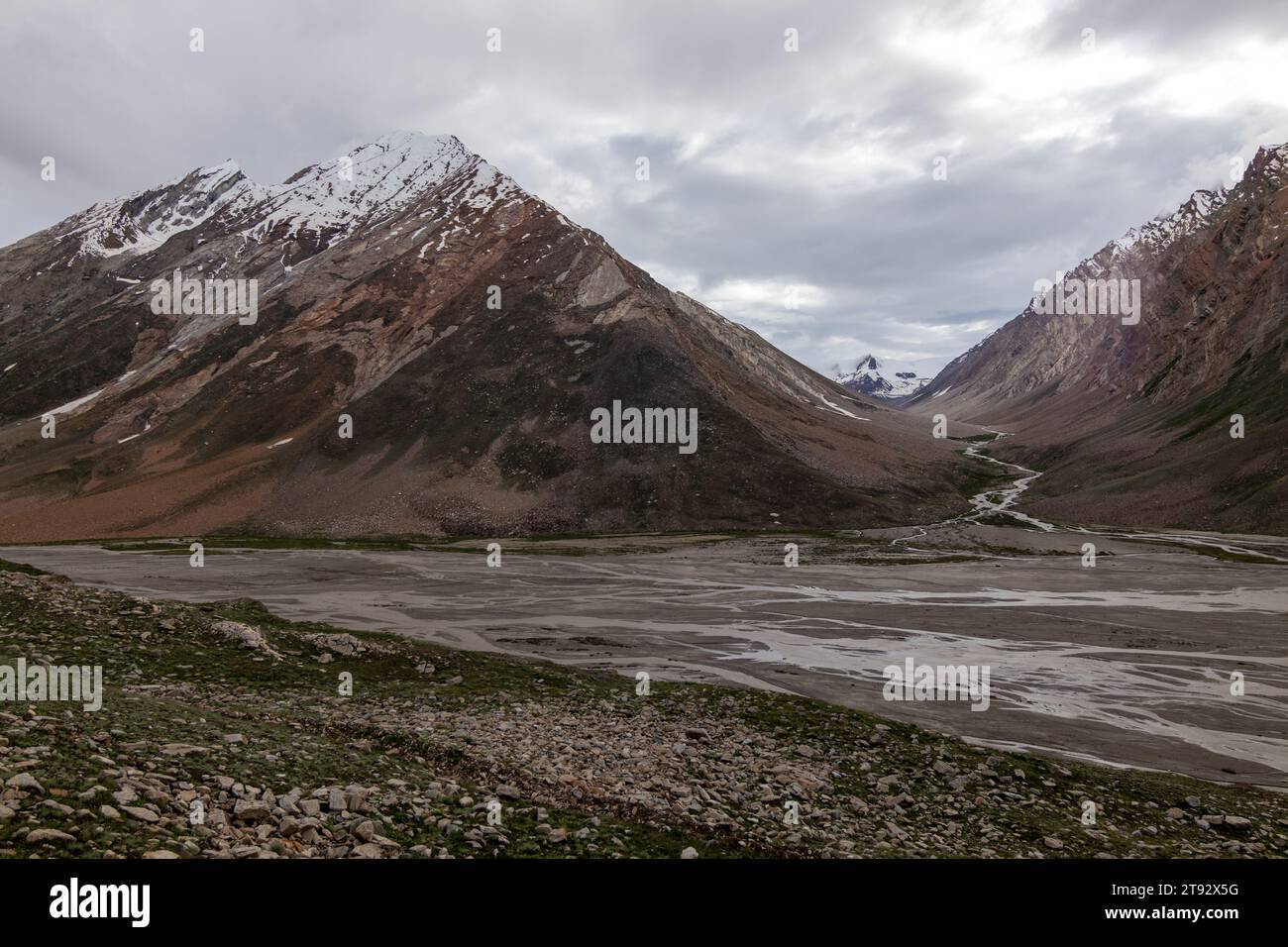 River flowing from a snow capped mountain Stock Photo - Alamy