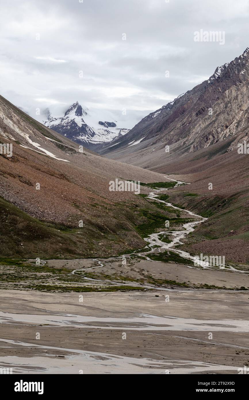 River flowing from a snow capped mountain Stock Photo - Alamy