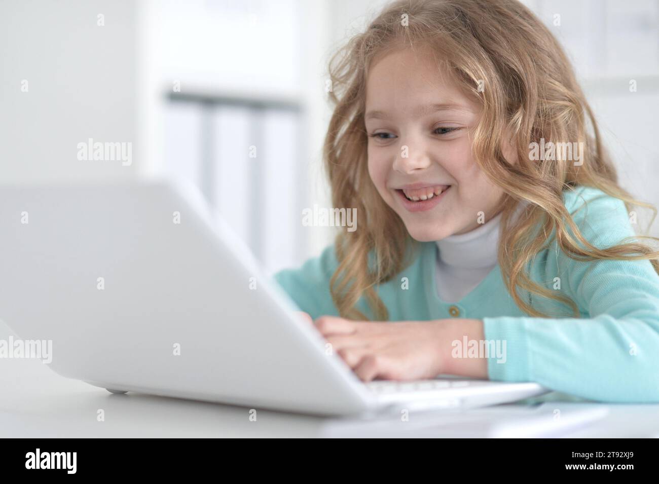 Cute and happy little girl children using laptop computer Stock Photo ...