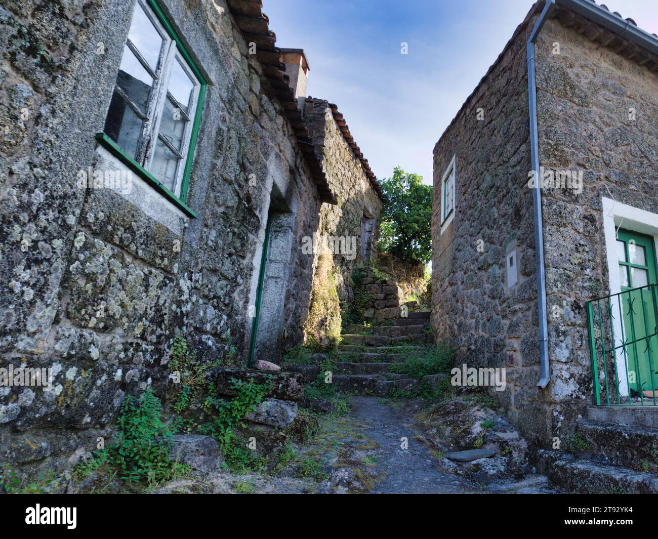 The stairs and stone houses and narrow historical streets in Monsanto ...
