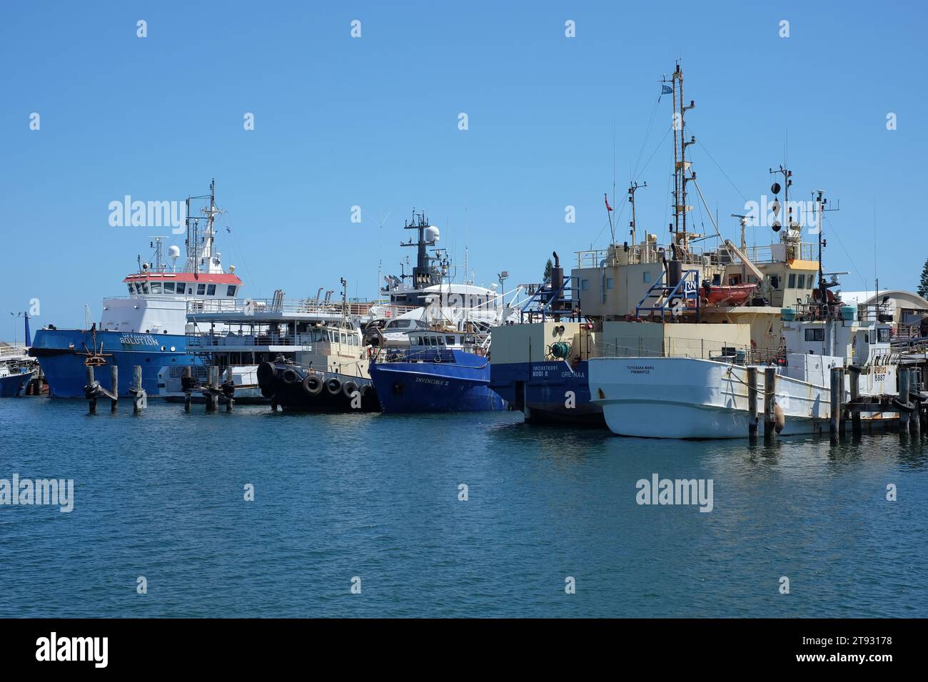 Tug boats and other commercial work boats moored at Fishing boat ...