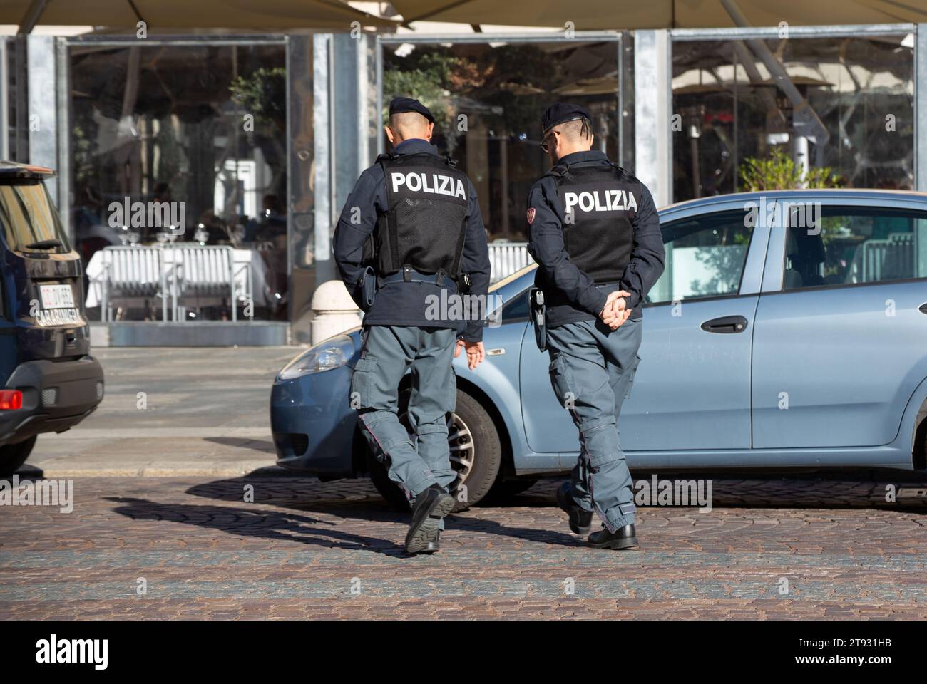 Police officers patrol the city center of Parma Italy Stock Photo - Alamy