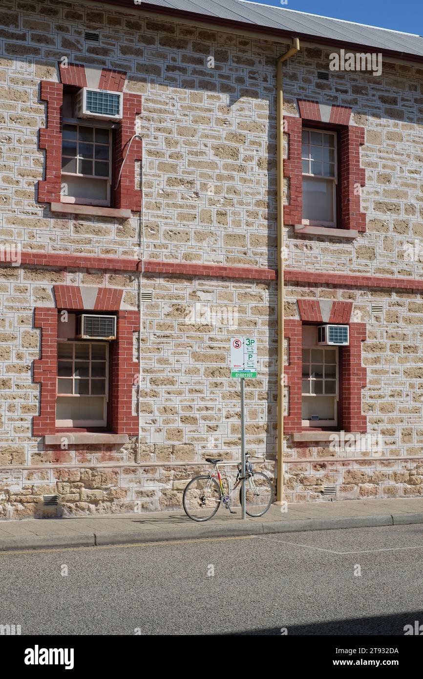 Windows of a two story stone warehouse building (1903) in Victorian ...