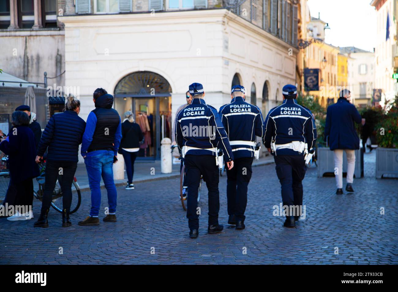 Police officers patrol the city center of Parma Italy Stock Photo - Alamy