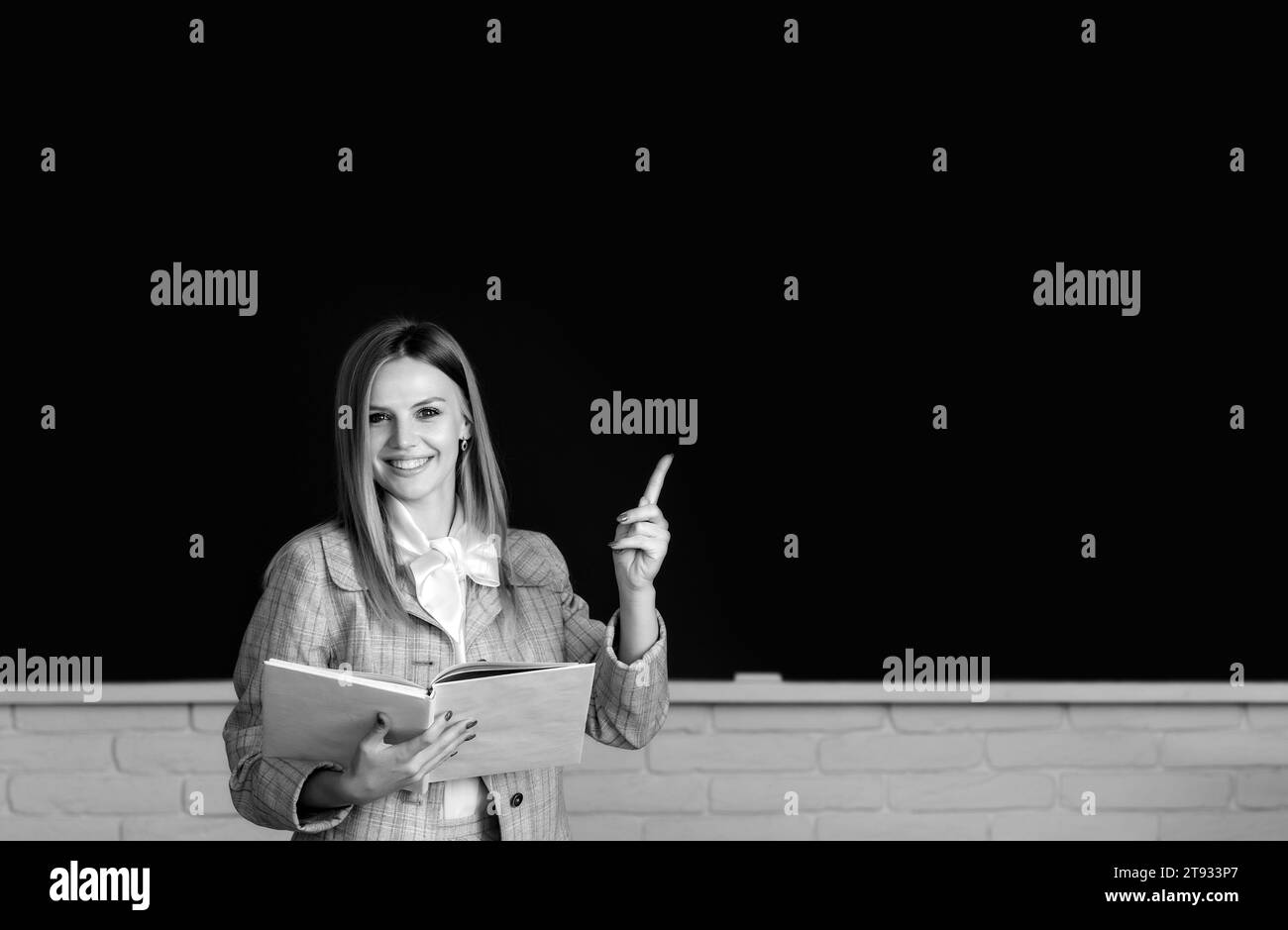 Female student with pointing finger in university, school education ...