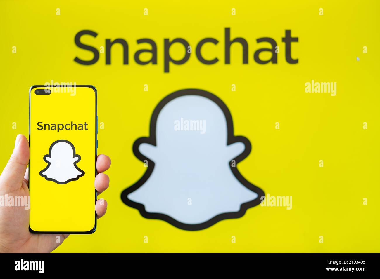 ZHONGSHAN China-July 6,2023:hand holding a mobile with snapchat logo at horizontal composition ...