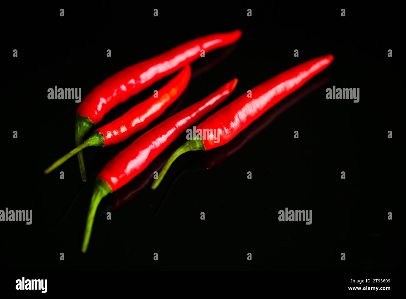 red chilli pod on black background Stock Photo - Alamy