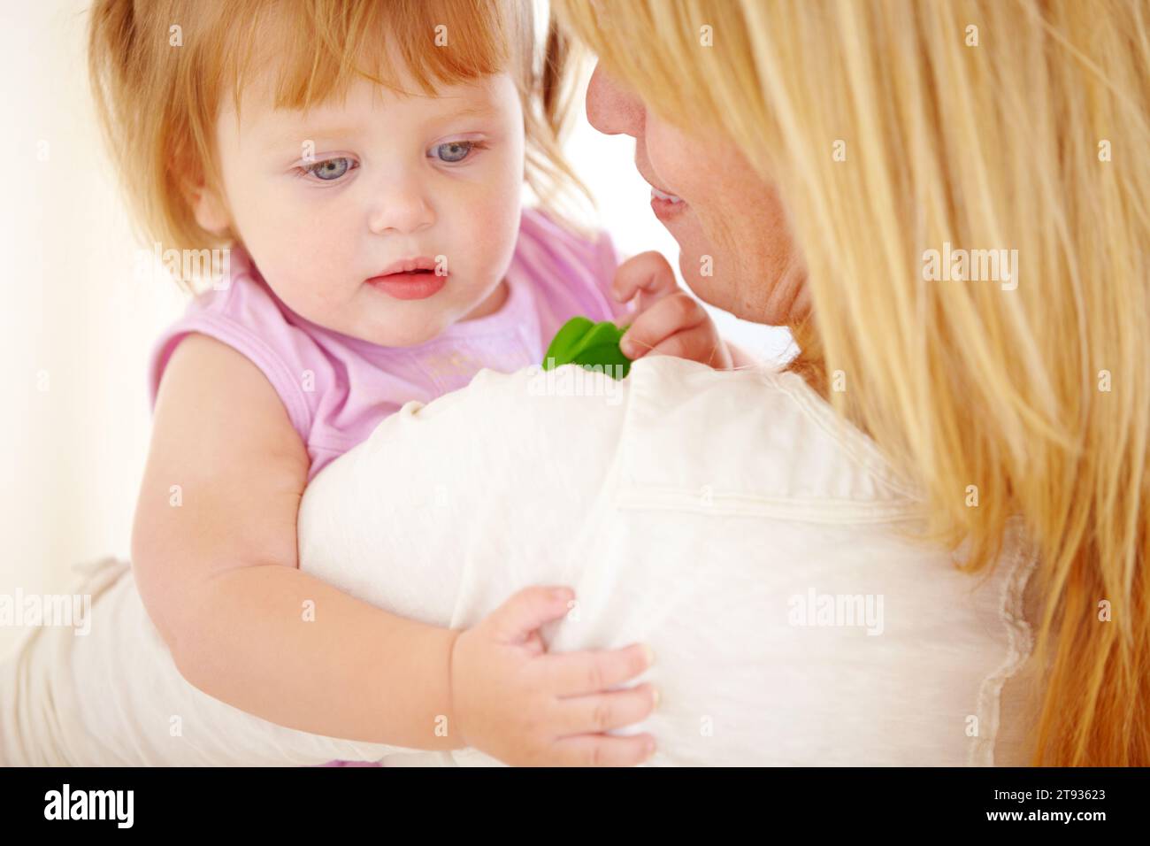 Woman, holding and baby girl in home for love or safety care, childhood ...