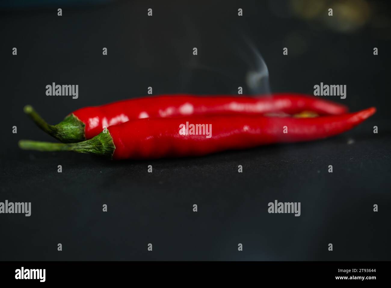 smoking chili peppers on a black background, clouds of smoke rise Stock ...