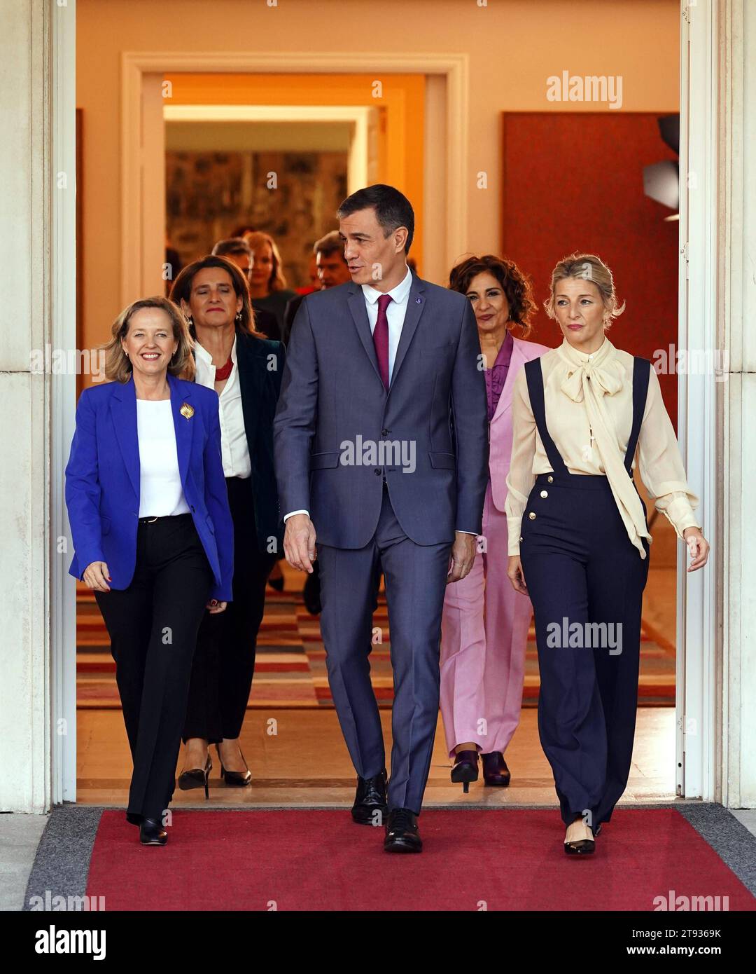 Spain's re-elected Prime Minister Pedro Sanchez poses with new members ...