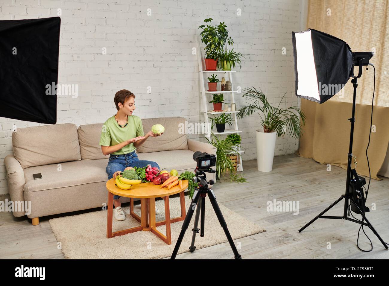 vegetarian vlog, woman with cabbage near table with vegetables and ...