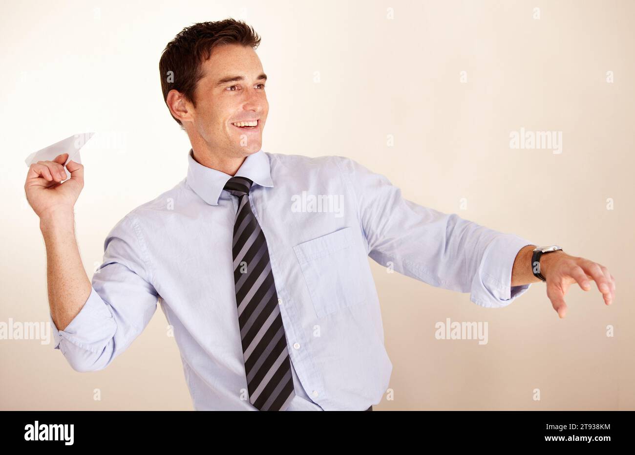 Business man, throw paper plane and happy for thinking, vision or game ...