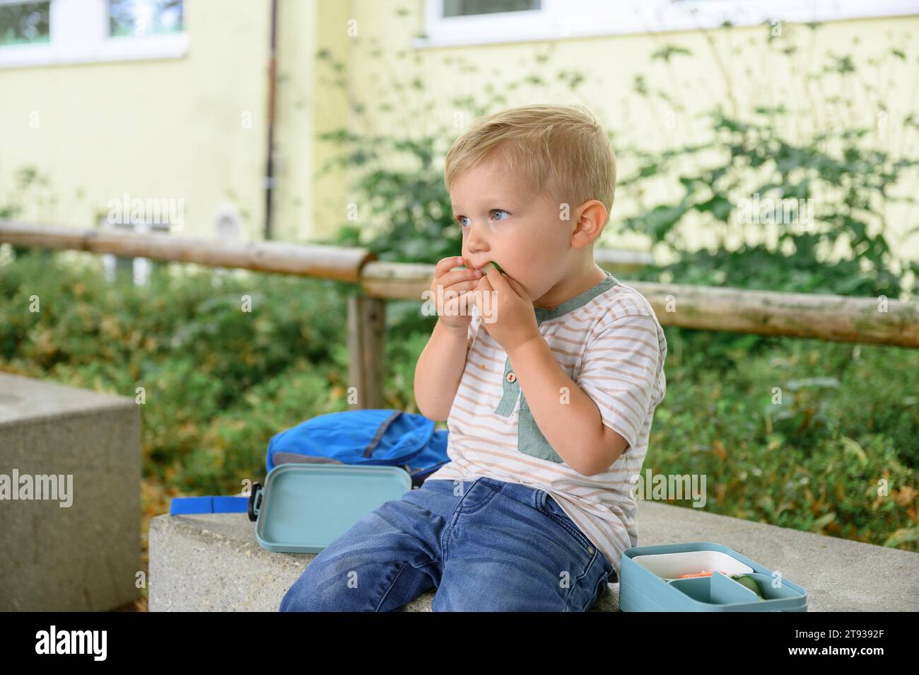 Adorable child backpack eating hi-res stock photography and images - Alamy