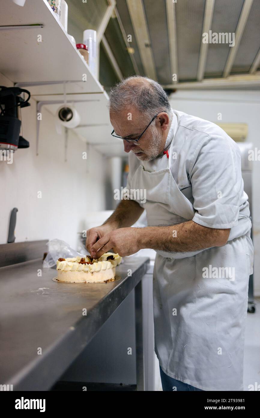Senior pastry chef decorating hi-res stock photography and images - Alamy