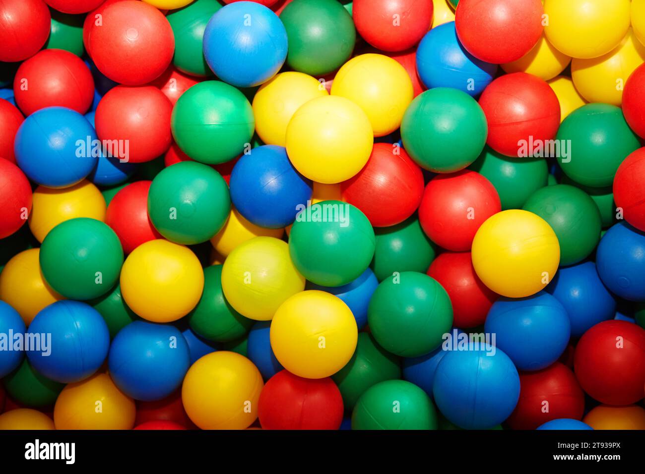 Group of many multicolored plastic balls. Close-up view Stock Photo - Alamy