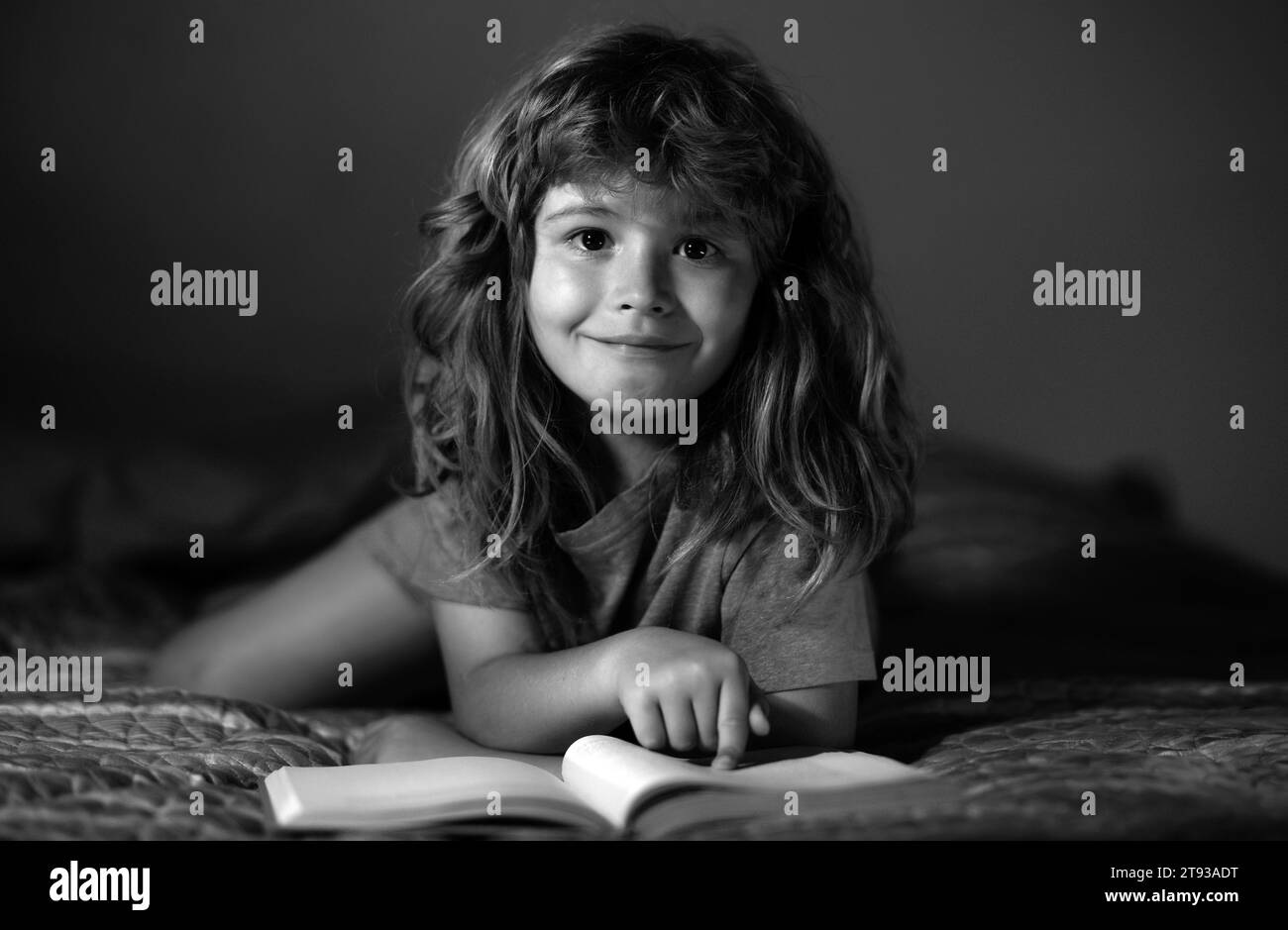Kids bedtime. Boy reading a book in bed. Child reading story with book ...